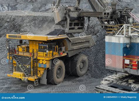 Excavator With Electric Shovel Loading The Rocks In Mining Truck At Quarry Haul Truck