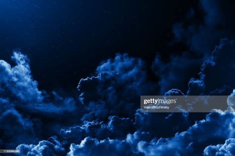 Mystical Midnight Sky With Stars Surrounded By Dramatic Clouds Dark