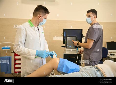 Medical Professional Giving Ultrasound Guided Intra Articular Knee