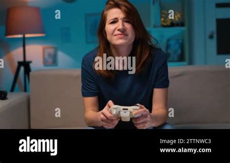 sad girl loses the video game at home at night excited gamer woman