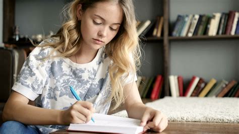 Cute Teen Girl Writes A Letter In Notebook 1387336 Stock Video At Vecteezy