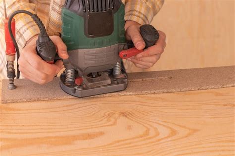 Premium Photo Crop Anonymous Male Carpenter Using Electric Milling