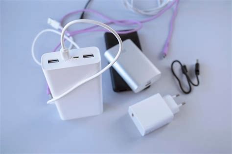 Premium Photo Power Bank External Battery And Usb Wire On The Table