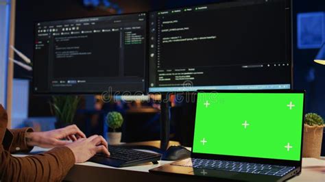 Green Screen Laptop In Home Office Used For Developing Software