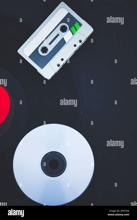 Music Storage Devices Through The Decades Vinyl Cassette Tape And Compact Disc Concept Of