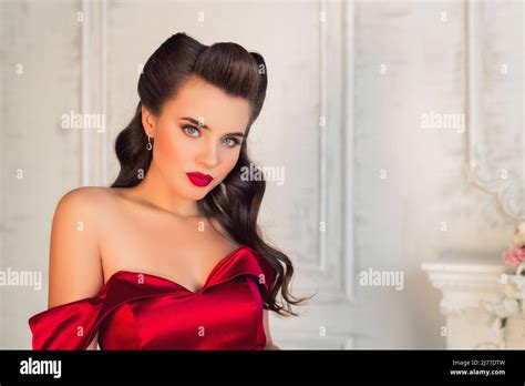 Beautiful Flirtatious Girl As A Pin Up Model In Dress In Retro Interior