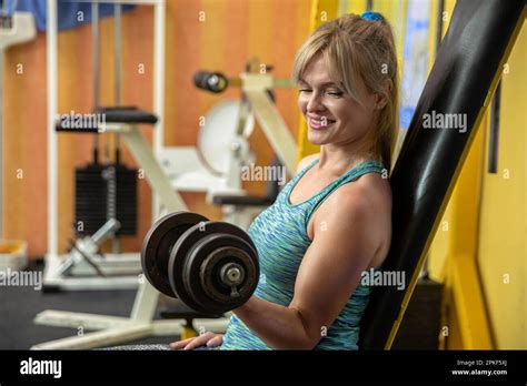 Physically Active Girl Uses Sports Equipment Available At The Gym Stock