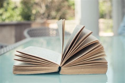 Premium Photo Close Up Of Open Book On Table
