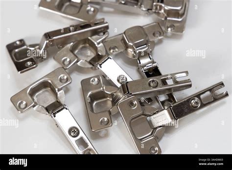 Metal Hinges For A Wardrobe Cabinet Shown In Close Up Suitable For