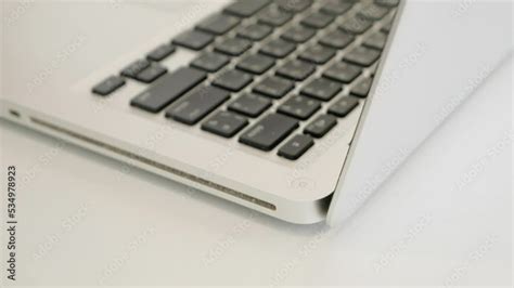 Woman Freelancer Opening Laptop And Putting Starts Power On Keyboard Of Computer Close Up Side