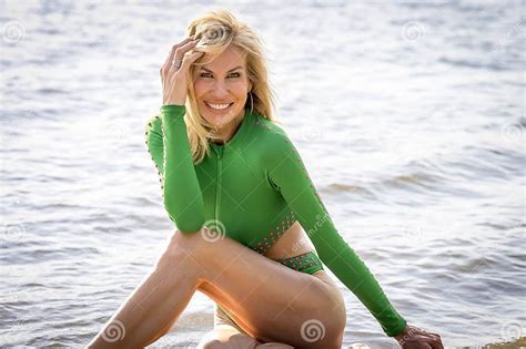Sunlit Elegance Mature Bikini Model Flaunts Curves And Beauty In