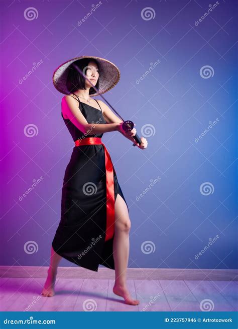 Slender Asian Woman An Asian Hat With A Katana In Her Hand Image Of A