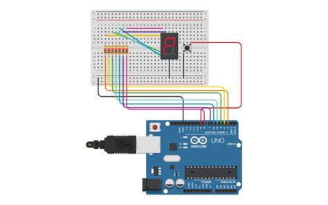 circuit design display de 7 segmentos con pulsador tinkercad