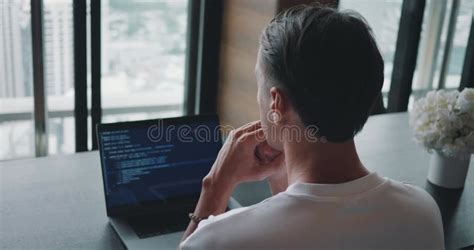 Over The Shoulder Man Programmer Working At Laptop Computer Sitting At Workplace In Office