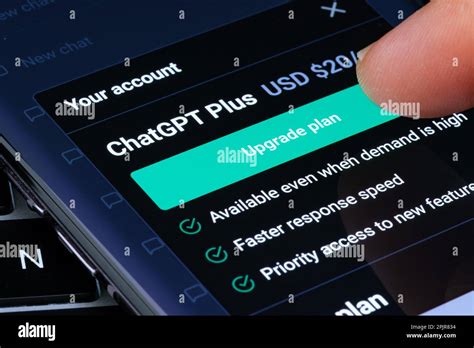 chatgpt plus option of ai chat gpt seen on smartphone placed on laptop