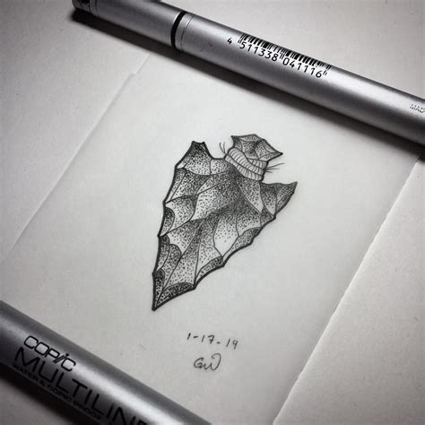 Simple Arrowhead Banger Tattoo Design