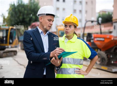 Male And Female Engineers In Construction Area Stock Photo Alamy
