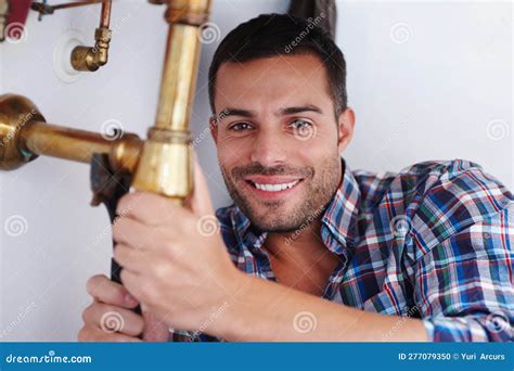 Handling His Spanner With Style Portrait Of An Smiling Young Man