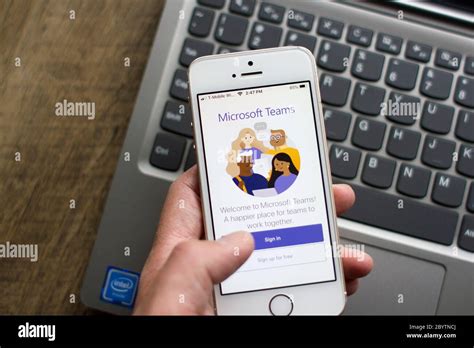 A User Opens The Microsoft Teams Mobile App Teams Is A Unified Team Communication And