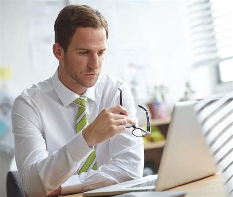 Thinking Glasses And Business Man On Laptop In Office For