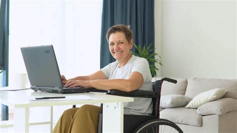 Motivated Senior Freelancer Is Working Typing In Laptop Sitting In