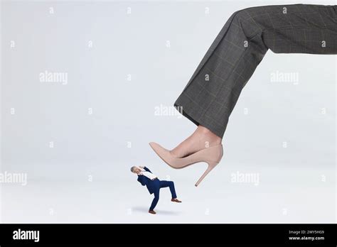 Big Woman Stepping Onto Small Man On White Background Stock Photo Alamy