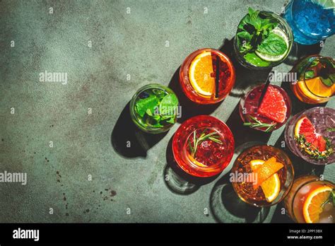 Cocktails Set On Rusty Green Bar Counter Top View Mixology Concept Assortment Of Colorful