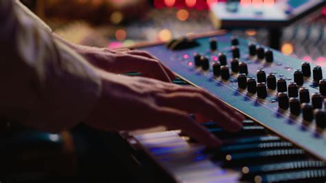 Young Singer Playing Piano Electronic Keyboard In Control Room