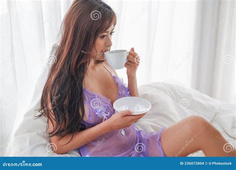 Portrait Asia Woman Wear Lingerie Or Underwear Lying On The Bed Stock