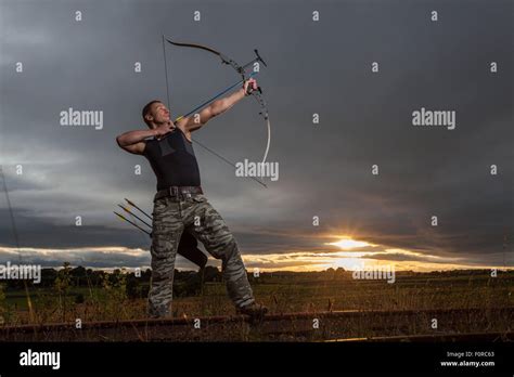 Man Aiming Bow Arrow Man Hi Res Stock Photography And Images Alamy
