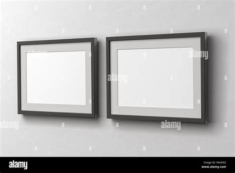 Blank Two Horizontal Posters On The White Wall With Dark Frame And