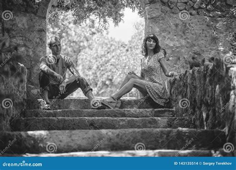 Happy Couple On Vacation Happy Guy And Girl Lovers Enjoy Each Other In The Evening Park Stock