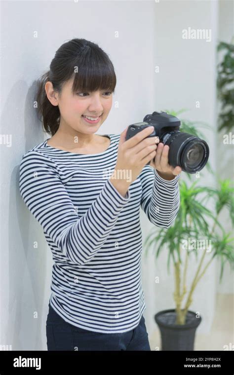 Woman Checking Photos Taken Stock Photo Alamy