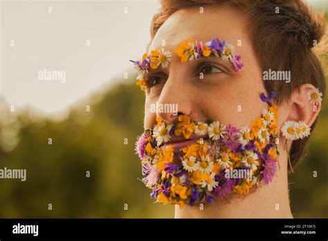 Trees Form The Backdrop For A Redhead With A Flowery Visage Such