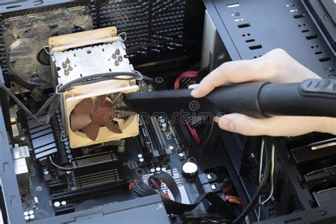 A Very Dirty Computer Fan Inside The Computer Being Cleaned With A Vacuum Cleaner Close Up Stock