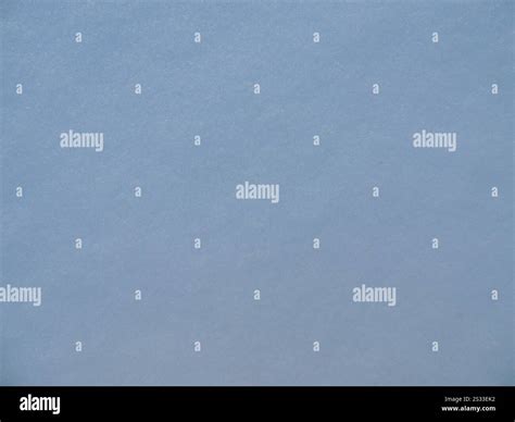 Pale Blue Background Of Natural Snow Crust Texture With White Glitters
