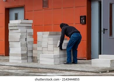 Man Block Concrete Laying Wall Images Stock Photos Vectors Shutterstock