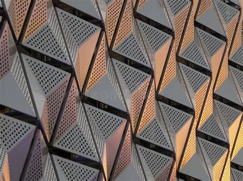 Modern Steel Angular Geometric Cladding With Colour Tones And Perforated Patterned Design Stock