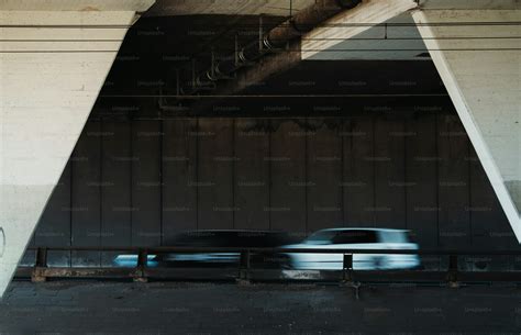 Cars Drive Through An Underpass Photo Car Image On Unsplash