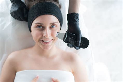 Woman On Ultrasonic Cleaning Procedure Hardware Cosmetology Stock