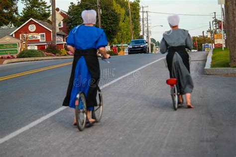 Two Bare Foot Amish Women On Bikes Editorial Stock Image Image Of