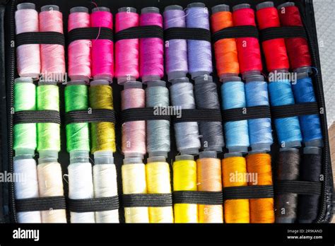 Sewing Layout With Multicolored Spools Of Thread Close Up Needles Coils Of Thread In A Special