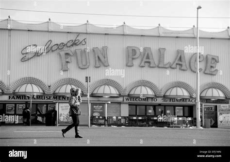 Blackpool Lancashire Uk Woman Walks Past The Deserted Silcocks Fun