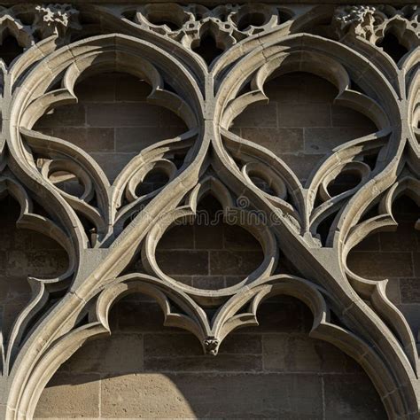 Ornate Gothic Stone Tracery Adorns A Building Displaying Intricate