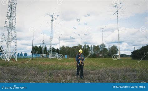 Telecommunication Operator On Field Between Towers Checking 5g Digital