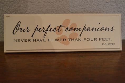 A Sign That Says Our Perfect Companions Never Have Fewer Than Four Feet