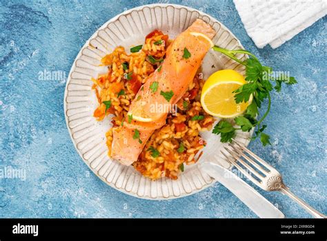 Baked Salmon With Chorizo Rice Stock Photo Alamy