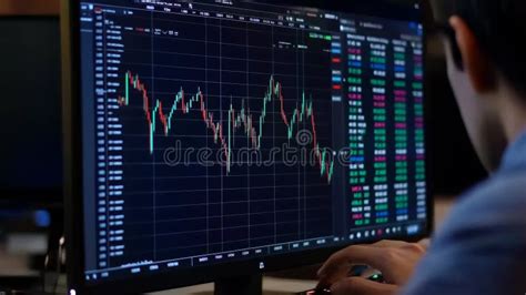Stock Market Trader Analyzing Financial Charts On Computer Screen Stock