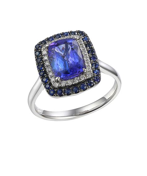 Cushion Cut Tanzanite Sapphire And Diamond Double Halo Ring Phillip Stoner The Jeweller
