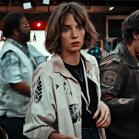 A Woman Standing In Front Of Other People